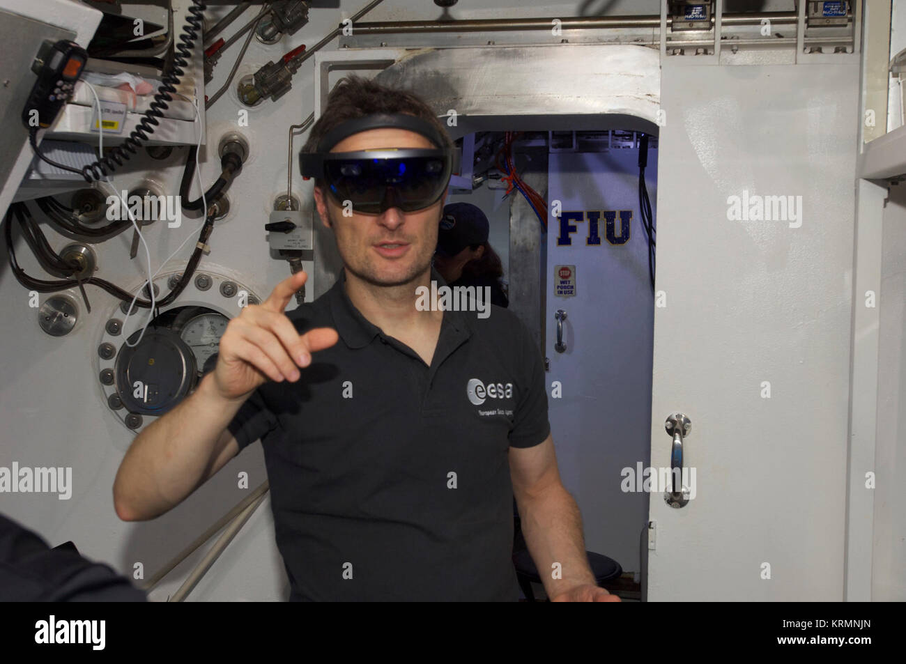 NEEMO 21 Matthias Maurer with HoloLens in the Aquarius habitat Stock ...