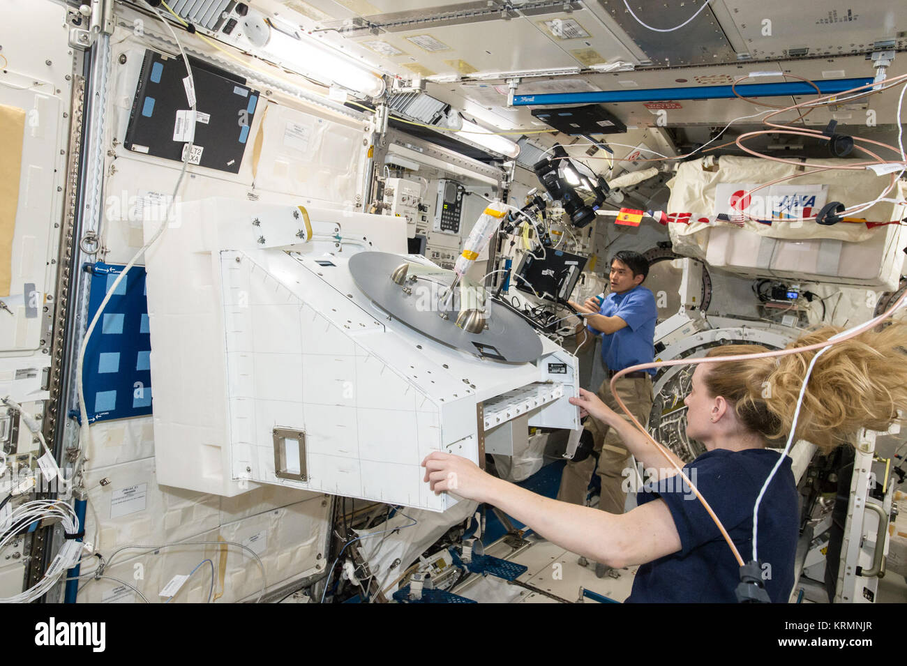 ISS-48 Takuya Onishi and Kate Rubins prepare the NREP in the Kibo lab ...