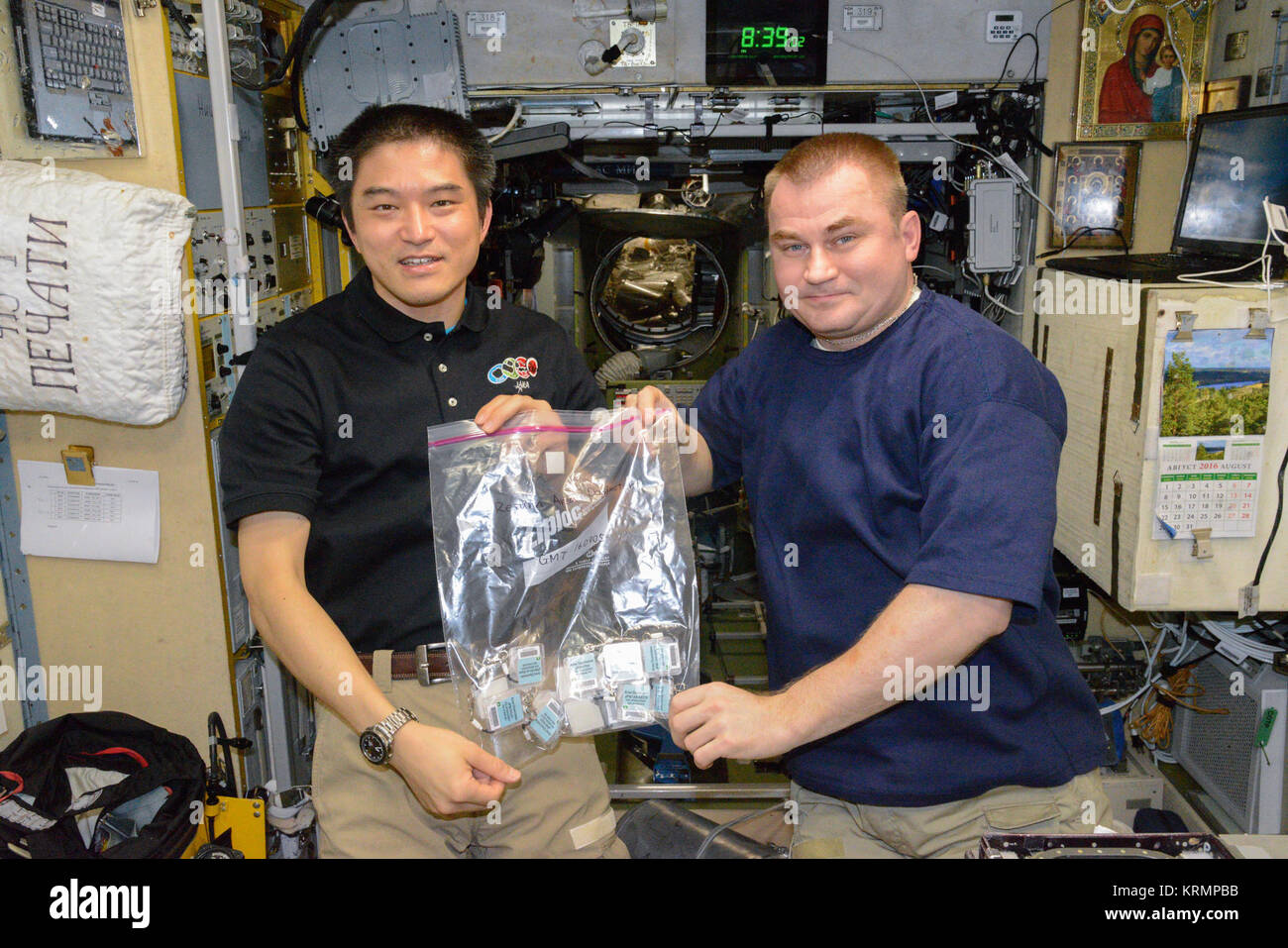 ISS-48 Takuya Onishi and Aleksey Ovchinin inside the Zvezda service ...