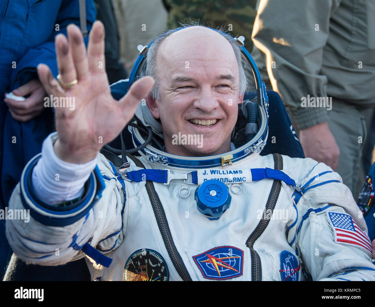 Expedition 48 NASA astronaut Jeff Williams rest in a chairs outside the ...