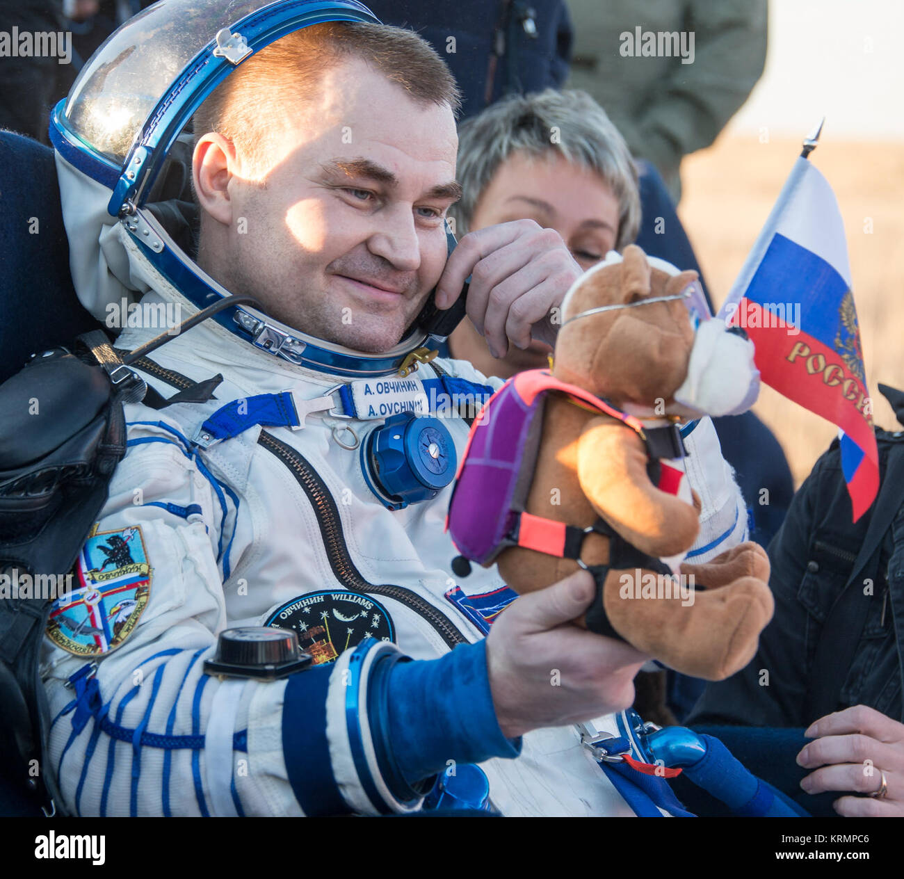 Russian cosmonaut Alexey Ovchinin of Roscosmos rest in a chair outside ...