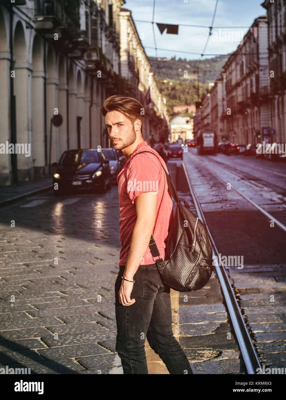 One handsome young man in city setting Stock Photo - Alamy