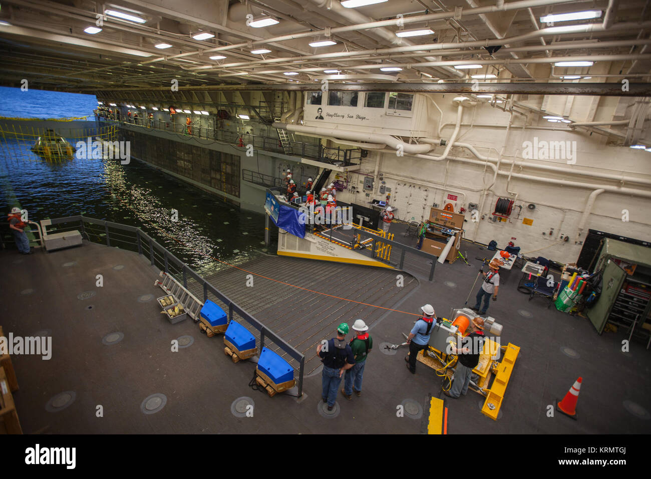 A test version of the Orion crew module attached to tether lines sits ...