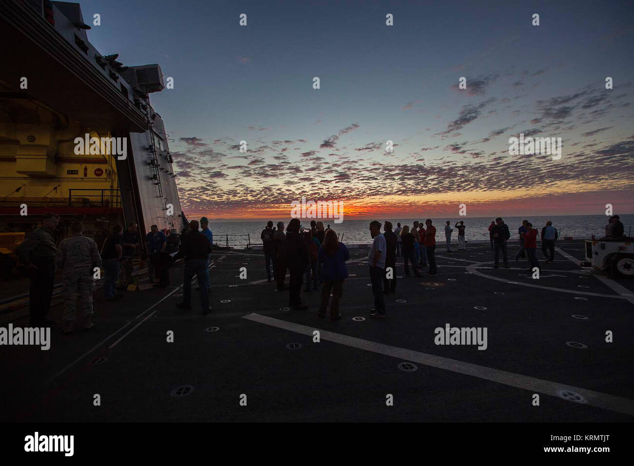 NASA, contractor and U.S. Navy personnel are on the deck of the USS San ...
