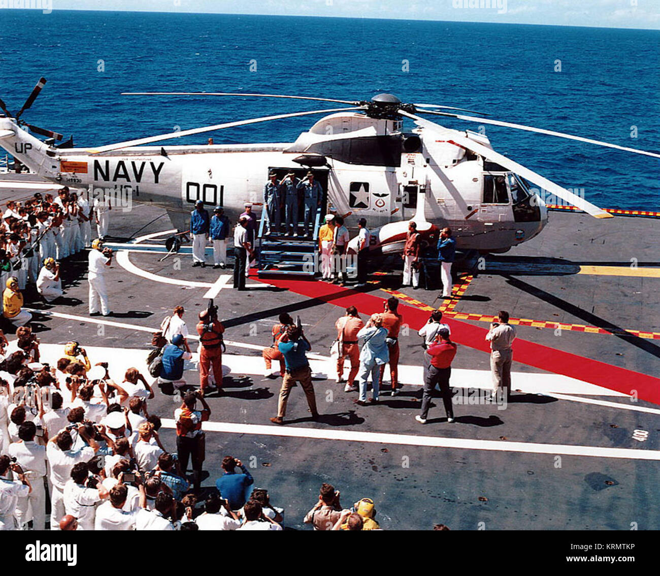 Apollo 16 crew exits recovery helicopter aboard Ticonderoga Stock Photo ...