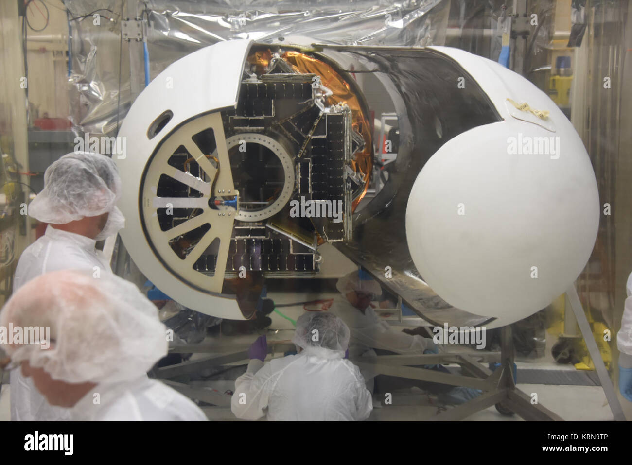 Technicians with Orbital ATK have installed the first half of the ...
