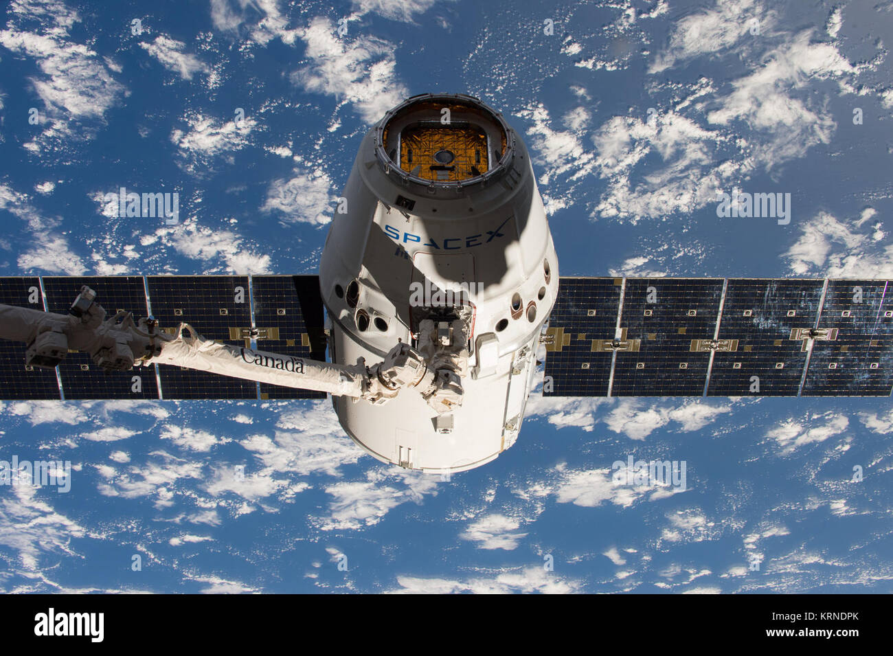 SpaceX CRS-11 Dragon grappled by the ISS Canadarm2 (ISS052e000442 Stock ...
