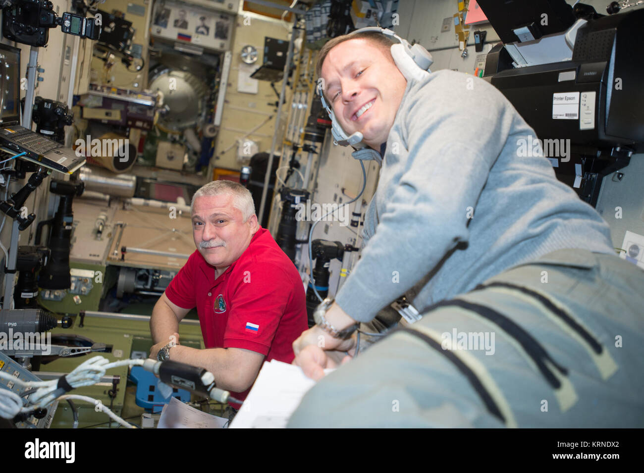 ISS-52 Fyodor Yurchikhin and Jack Fischer working inside the Zvezda ...