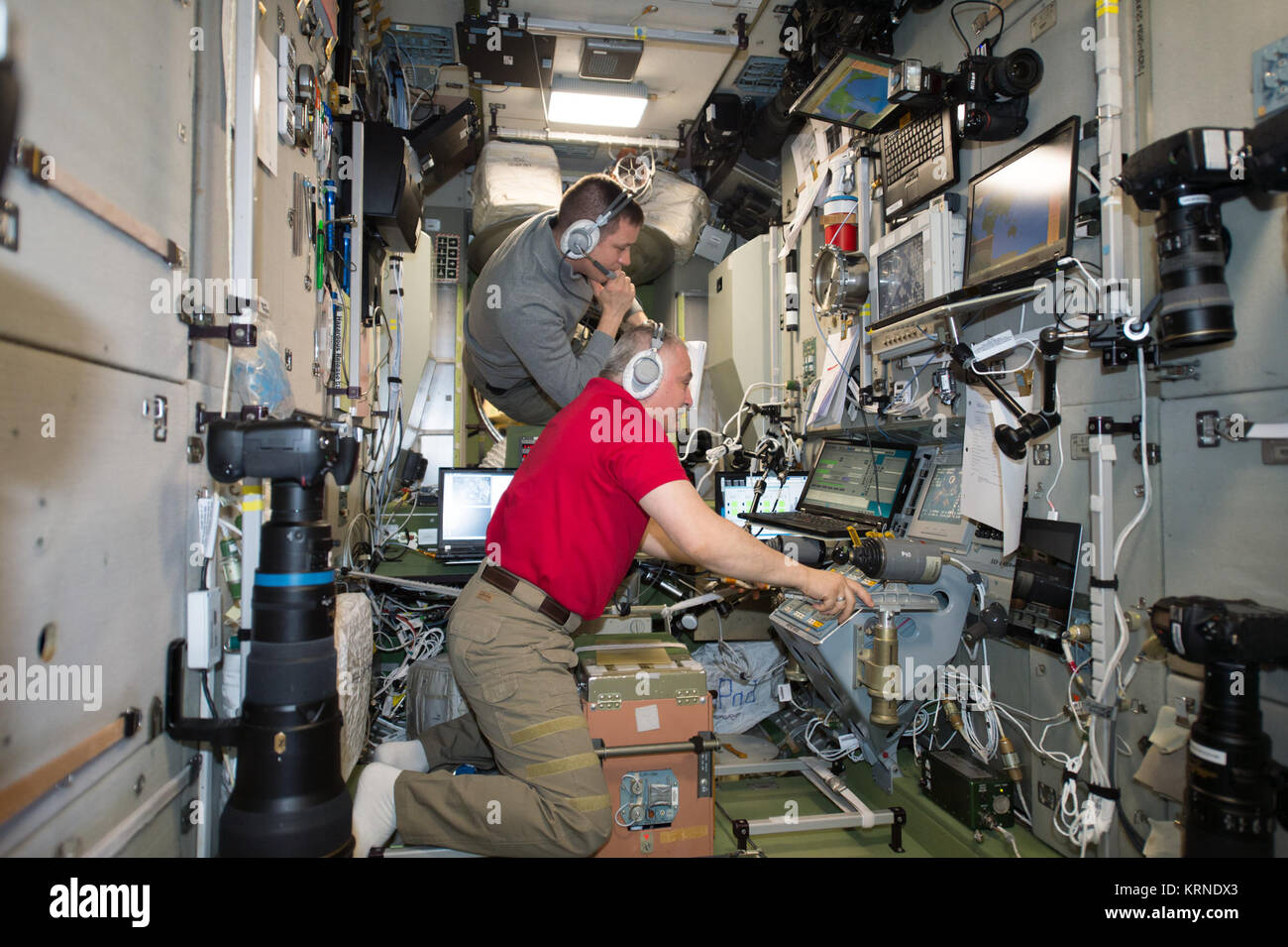 ISS-52 Fyodor Yurchikhin and Jack Fischer inside the Zvezda service ...