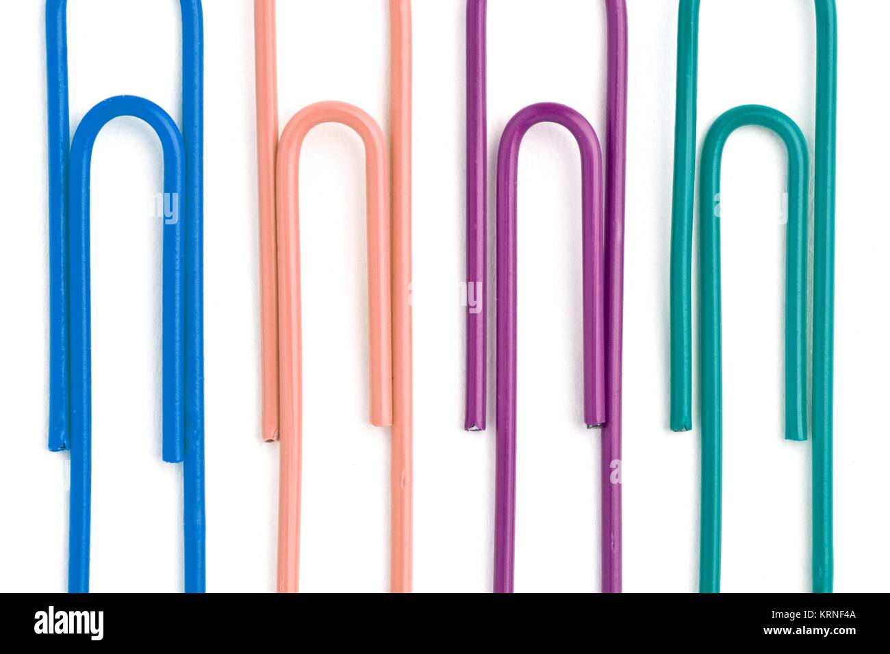 four paper clips arranged side by side Stock Photo - Alamy