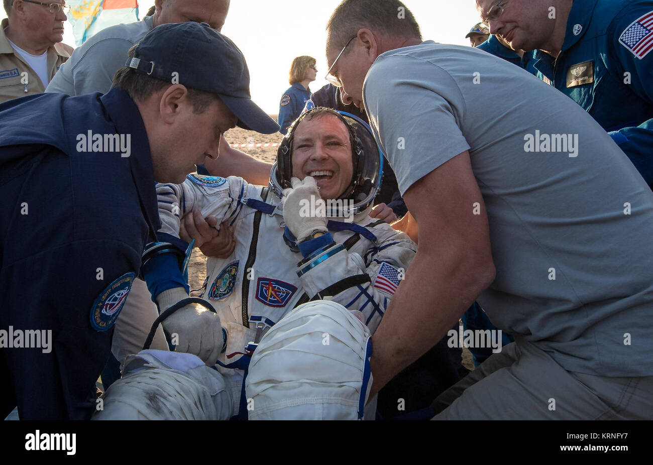 Expedition 52 NASA astronaut Jack Fischer is helped out of the Soyuz MS ...