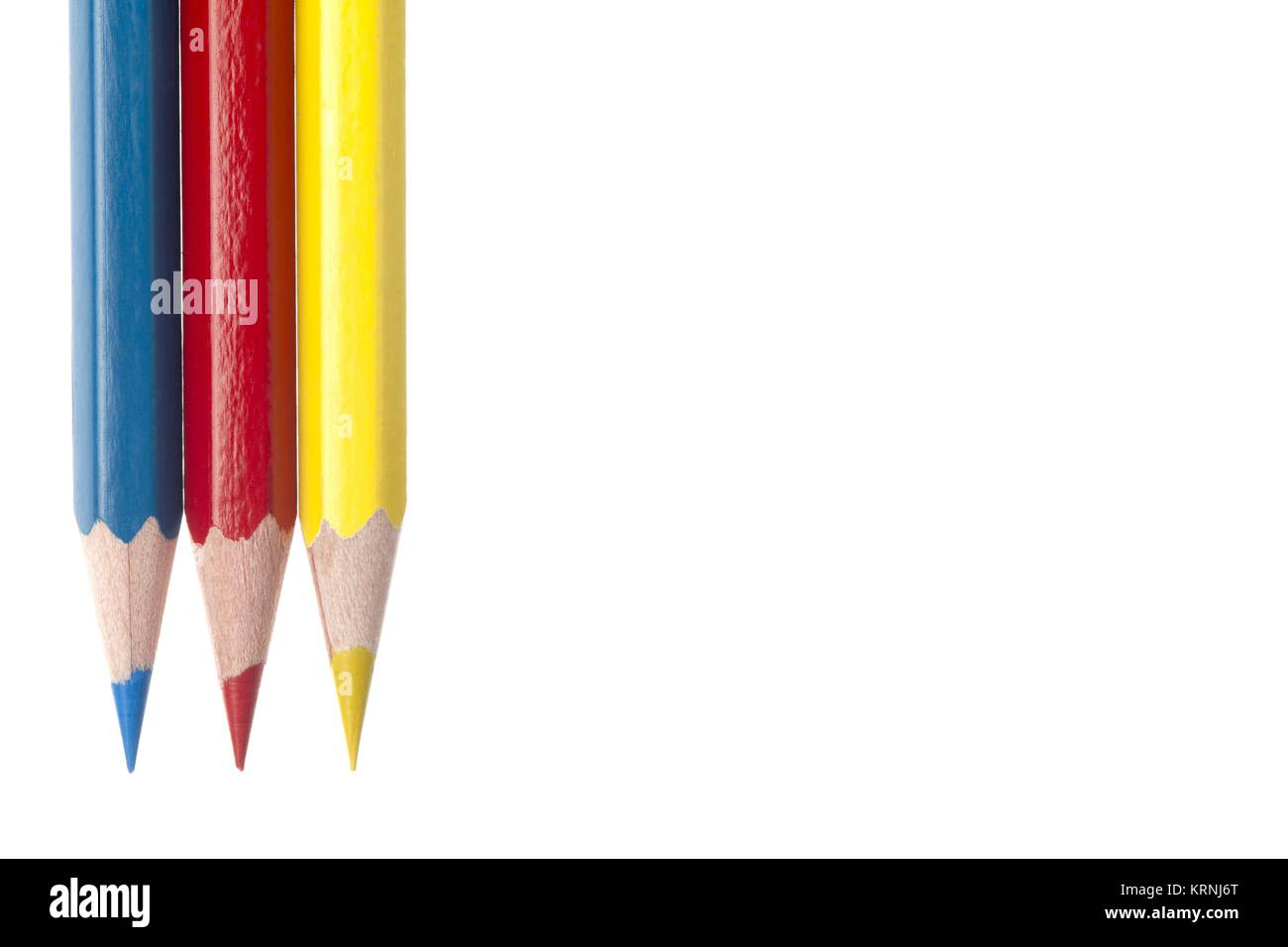 three color pencils on white background Stock Photo - Alamy