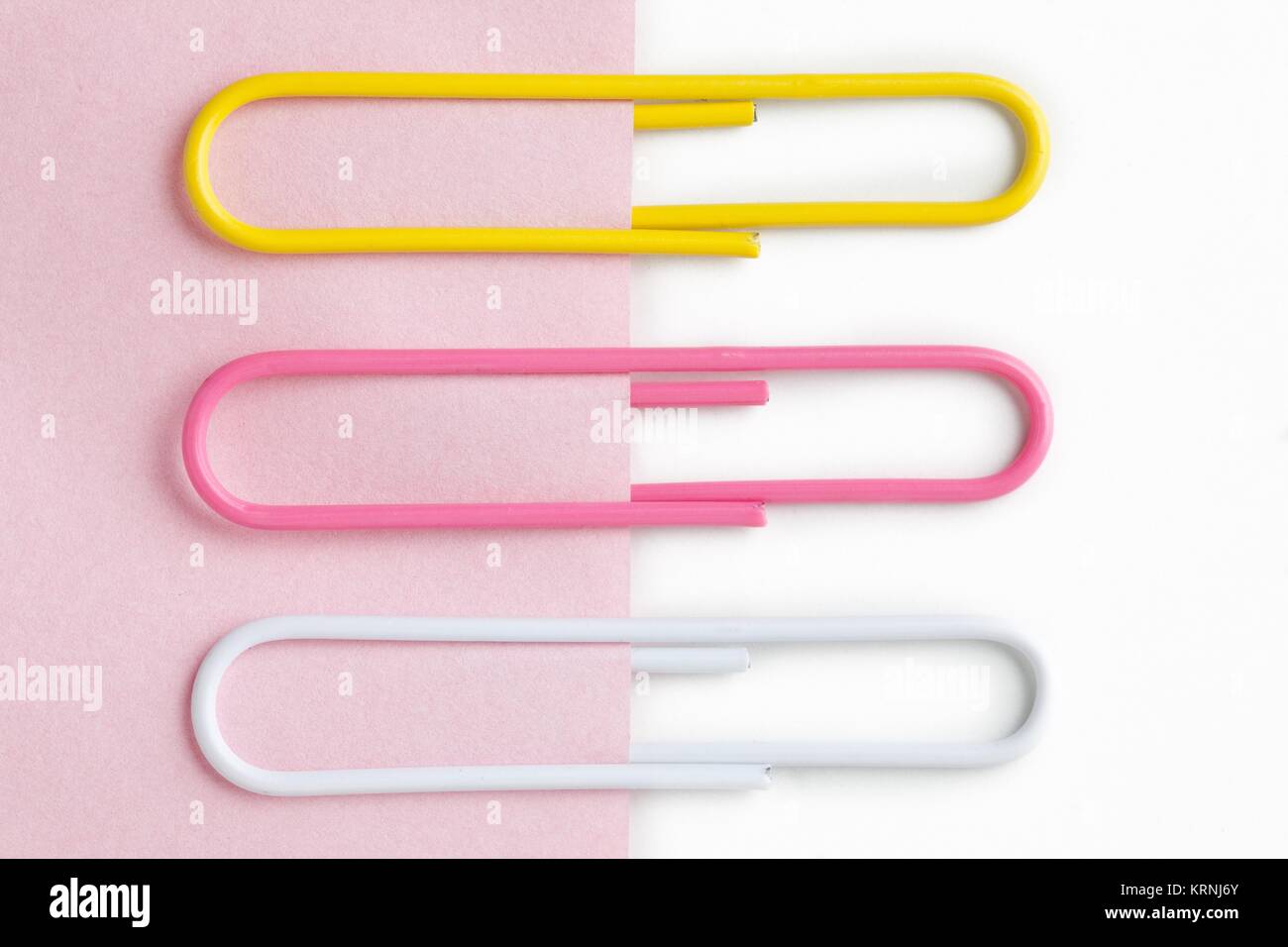 three paper clips on note Stock Photo - Alamy