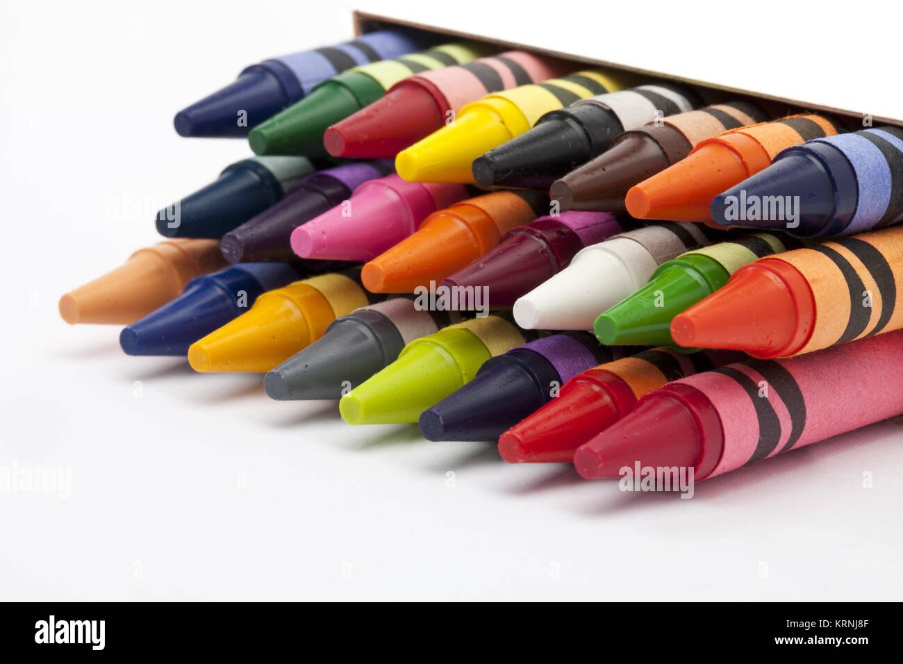 view of crayons stacked on white background Stock Photo - Alamy