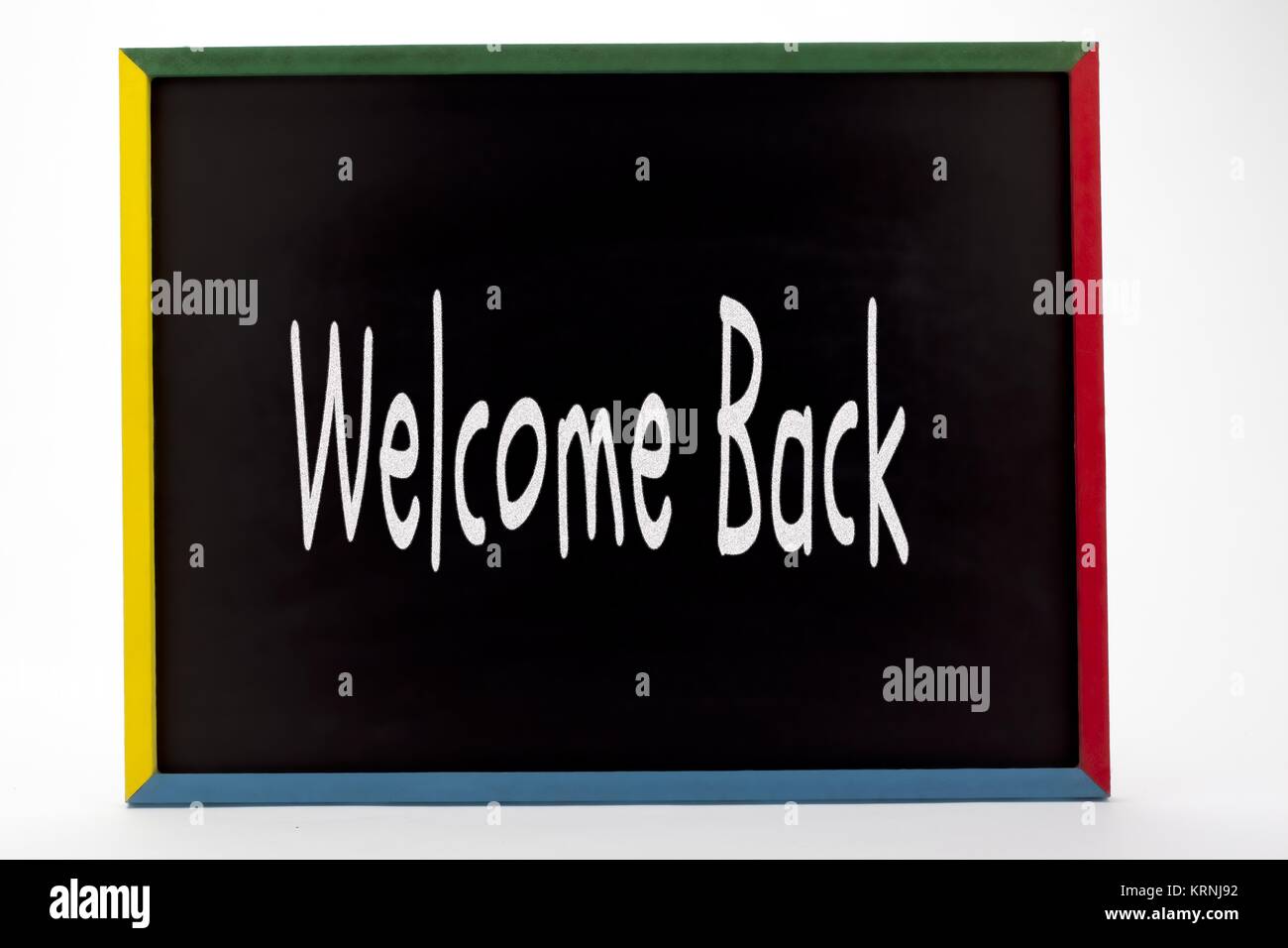 welcome back written on slate board Stock Photo - Alamy