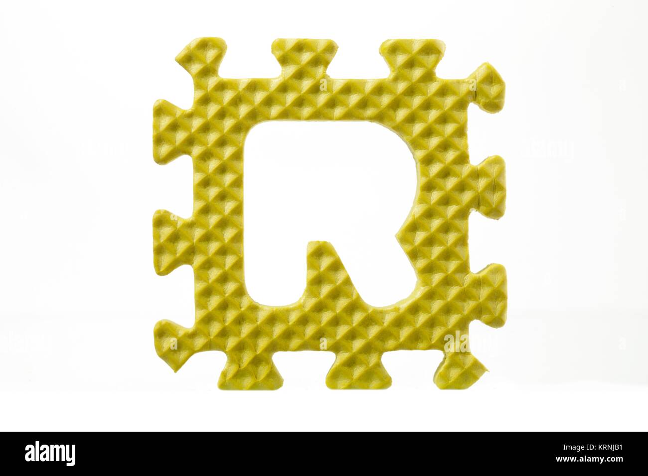 yellow letter r puzzle piece Stock Photo - Alamy