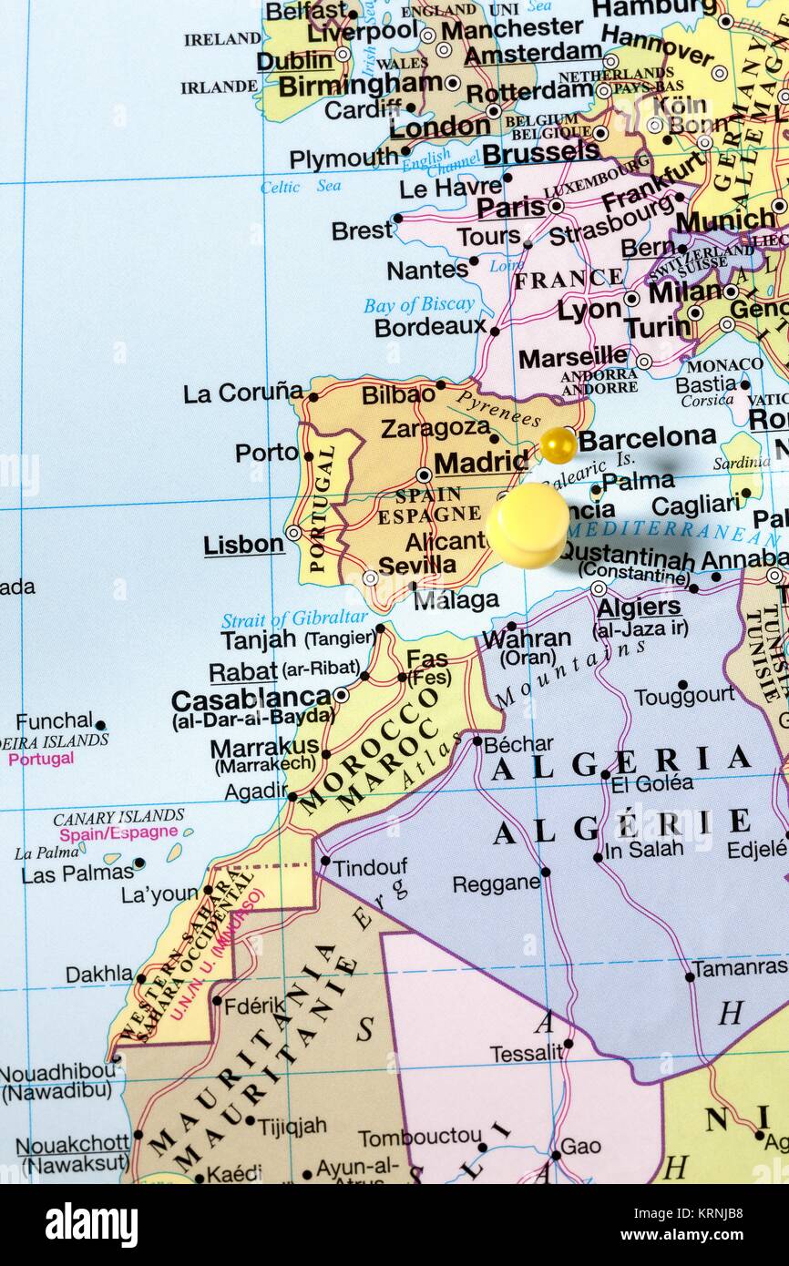 yellow push pins on world map Stock Photo - Alamy