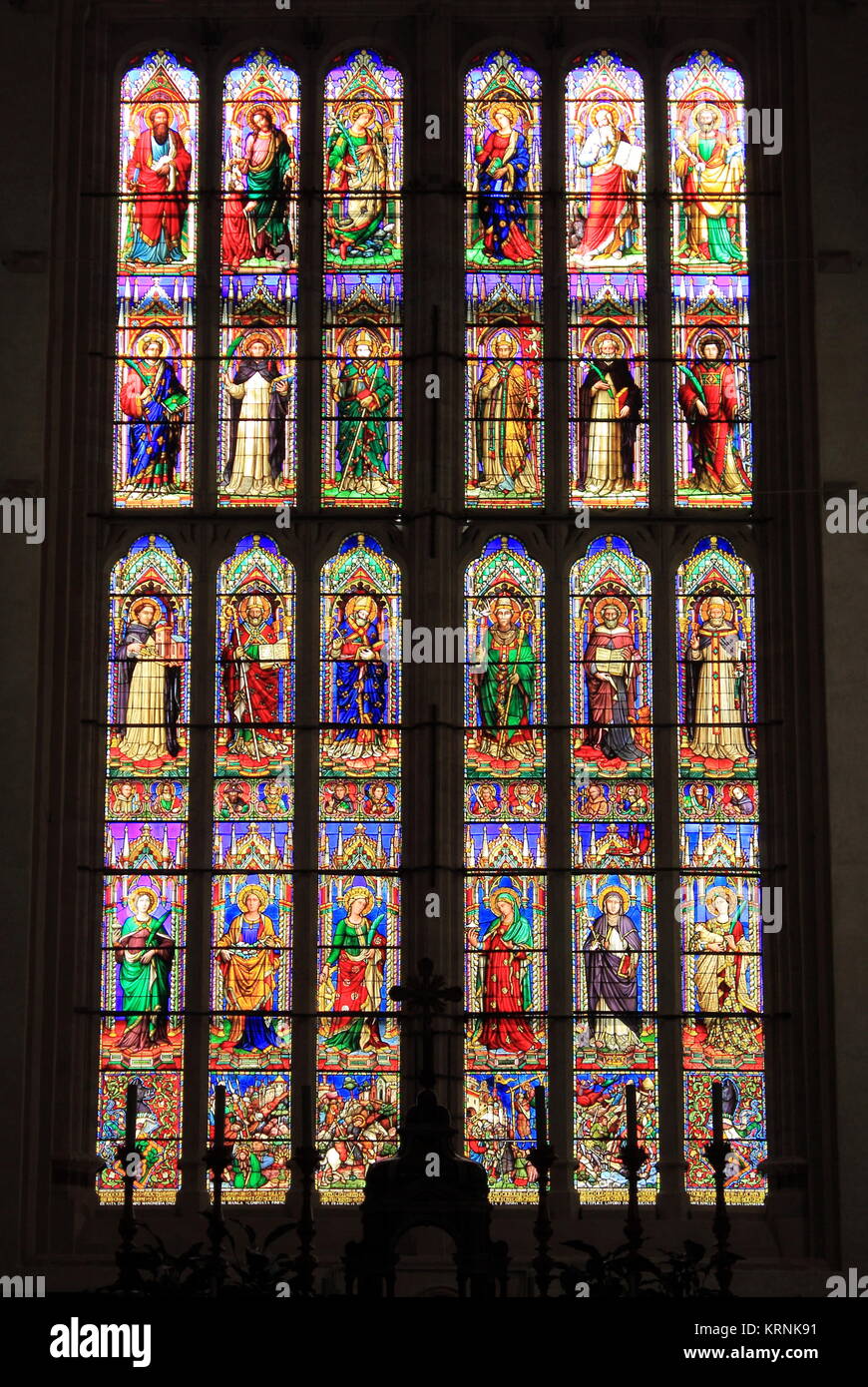 Stained glass window with some saints Stock Photo - Alamy