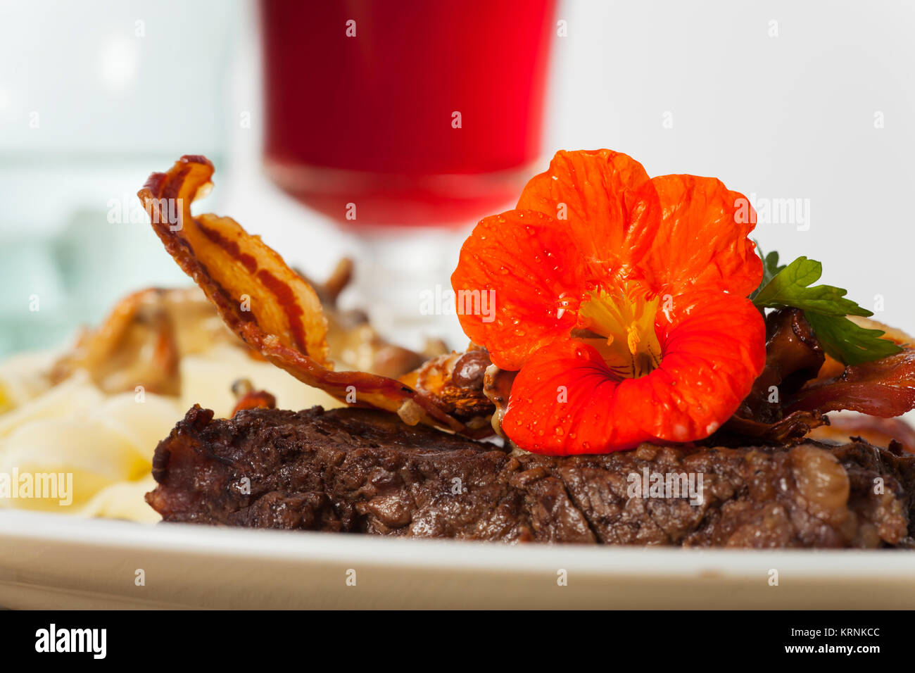 nasturtium flower on a steak Stock Photo - Alamy