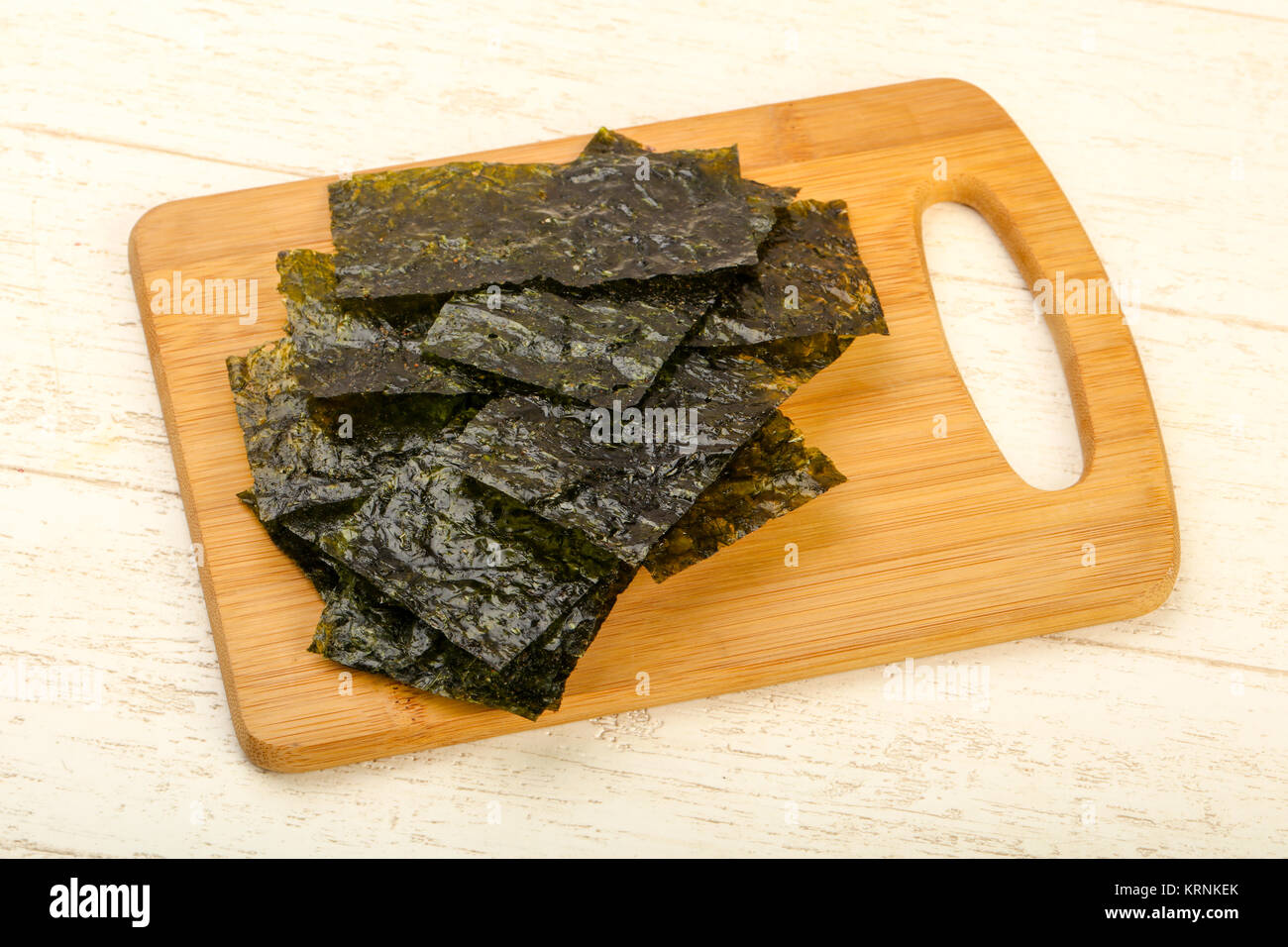 Crispy Nori sheets chips over wooden background Stock Photo - Alamy