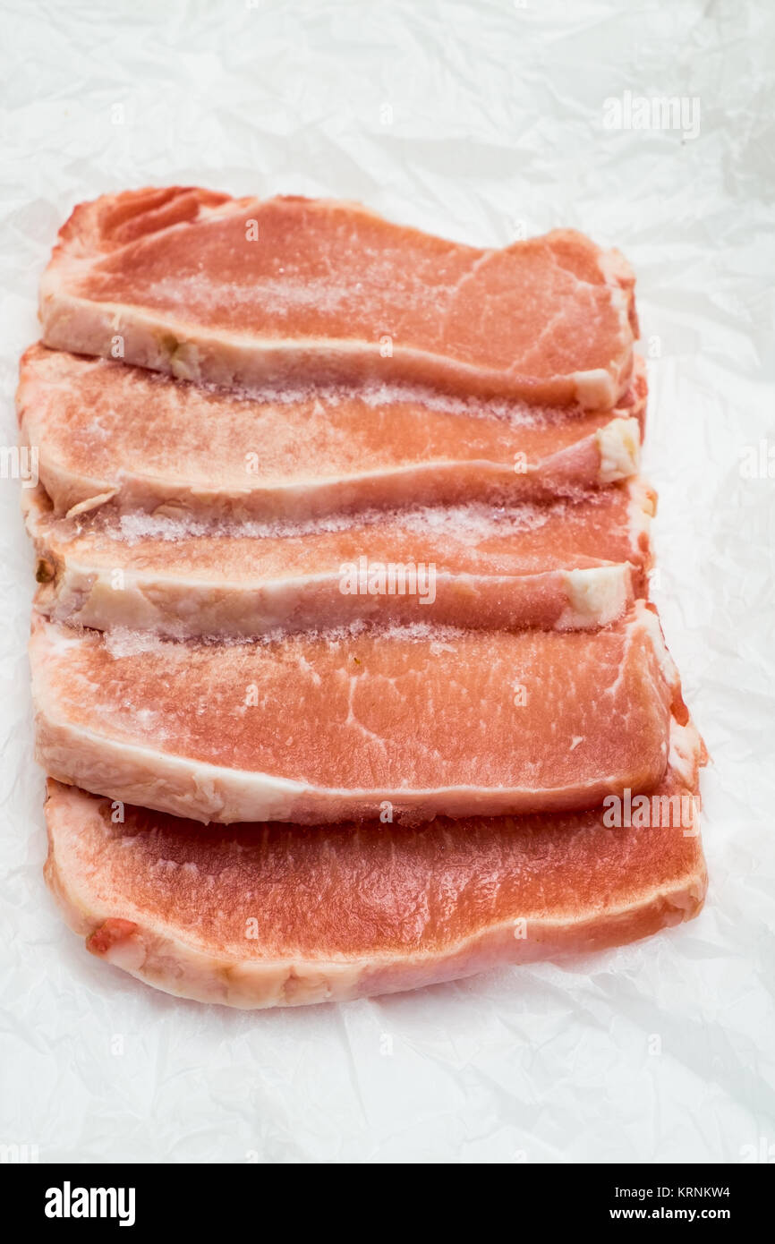 Frozen meat steaks Stock Photo - Alamy