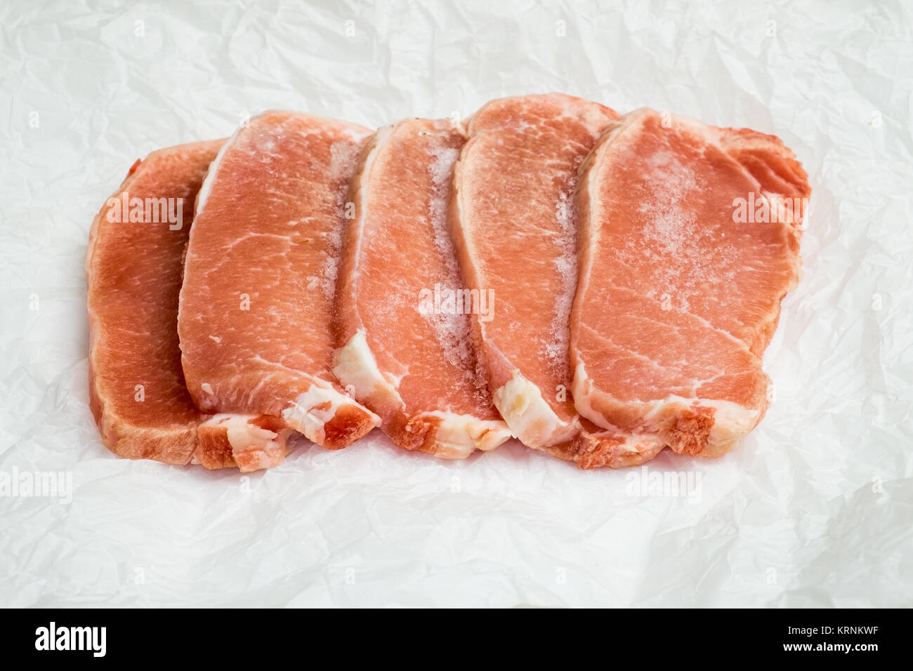 Frozen meat steaks Stock Photo - Alamy