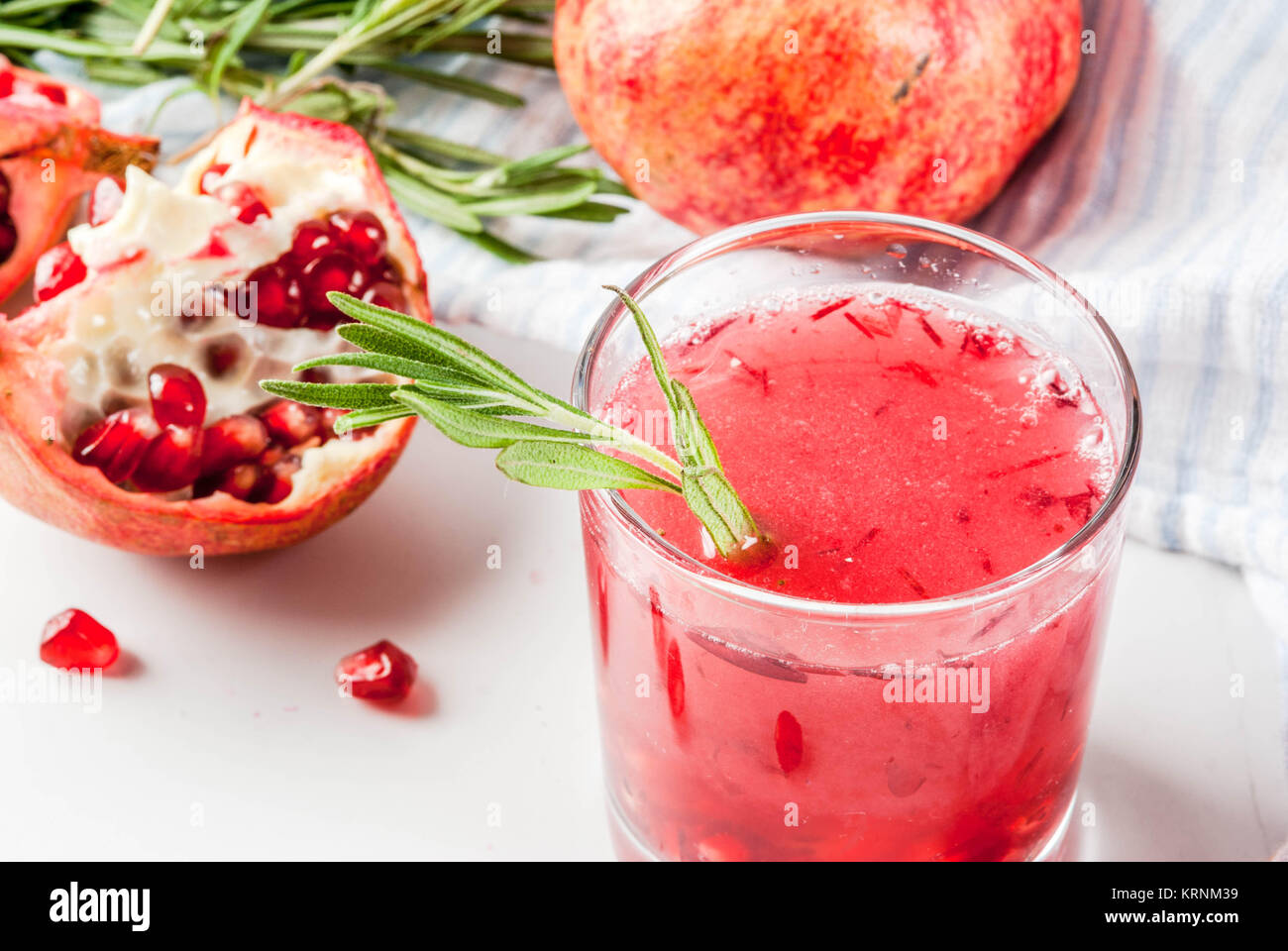 Homemade boozy alcoholic pomegranate cocktail with rosemary and vodka ...