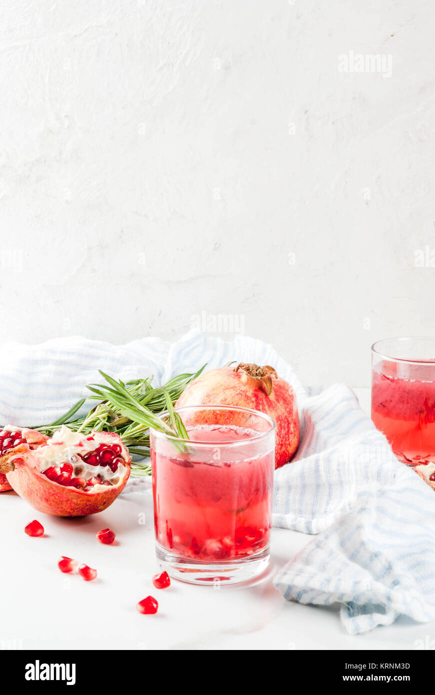 Homemade boozy alcoholic pomegranate cocktail with rosemary and vodka ...