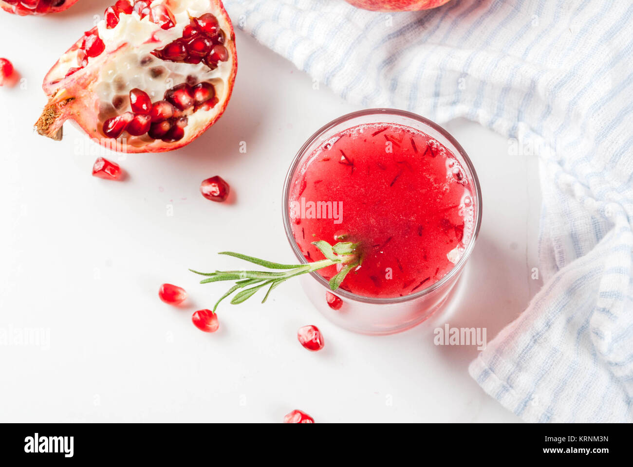 Homemade boozy alcoholic pomegranate cocktail with rosemary and vodka ...