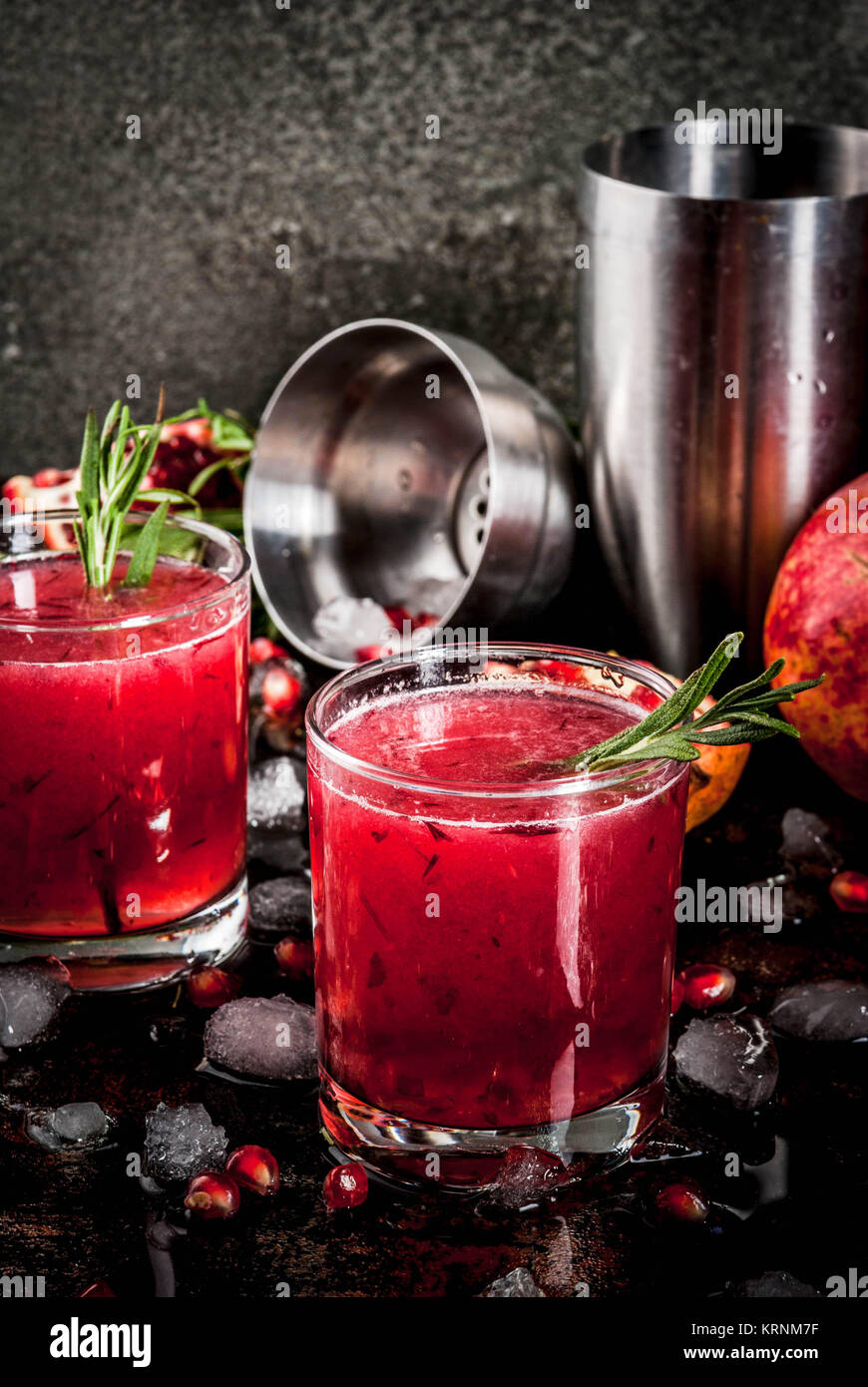 Homemade boozy alcoholic pomegranate cocktail with rosemary and vodka ...