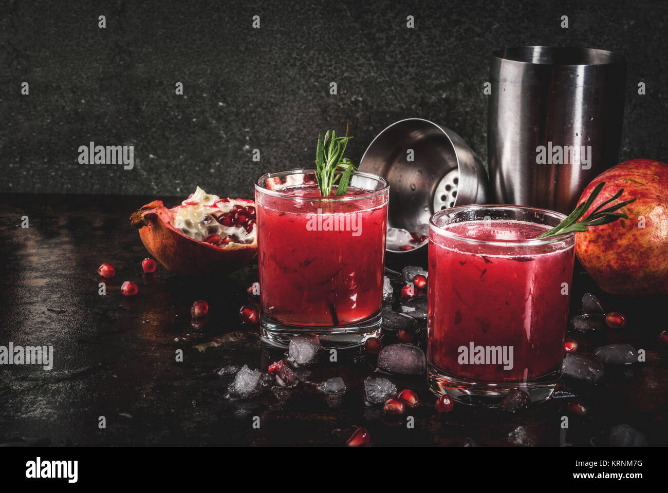 Homemade boozy alcoholic pomegranate cocktail with rosemary and vodka ...
