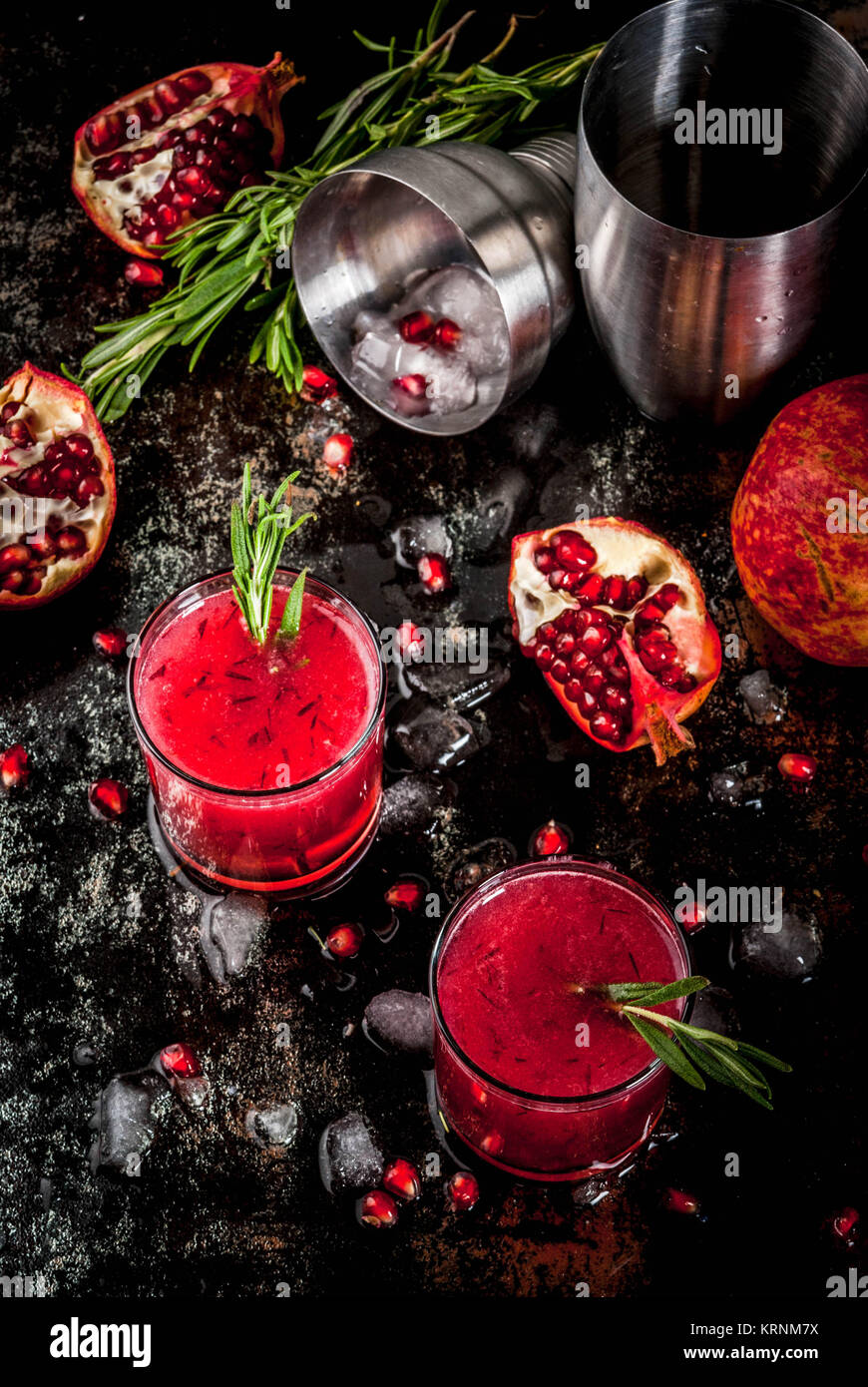 Homemade boozy alcoholic pomegranate cocktail with rosemary and vodka ...