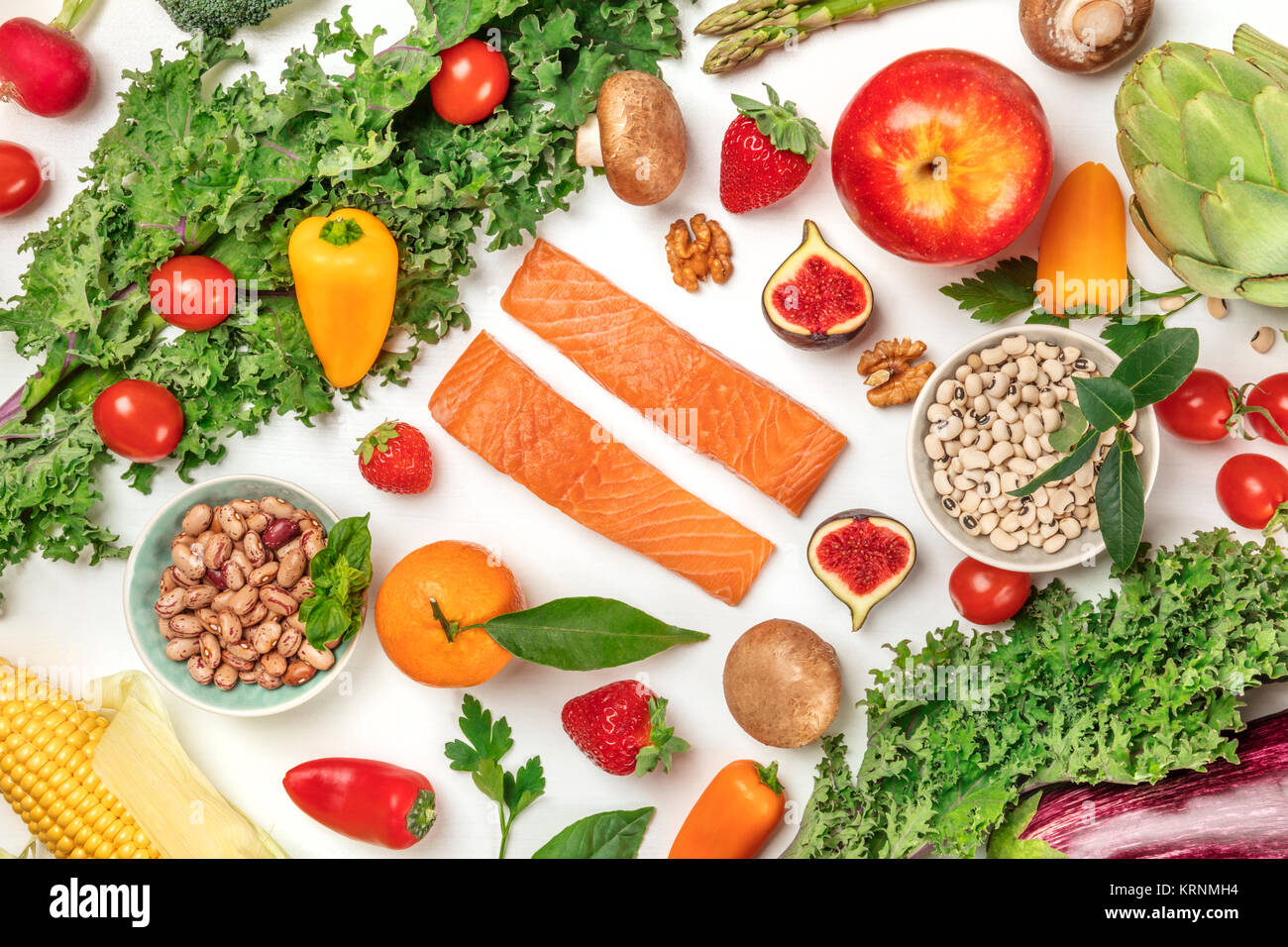 Vibrant fresh food, vegetables, fruits, legumes, fish on white Stock ...