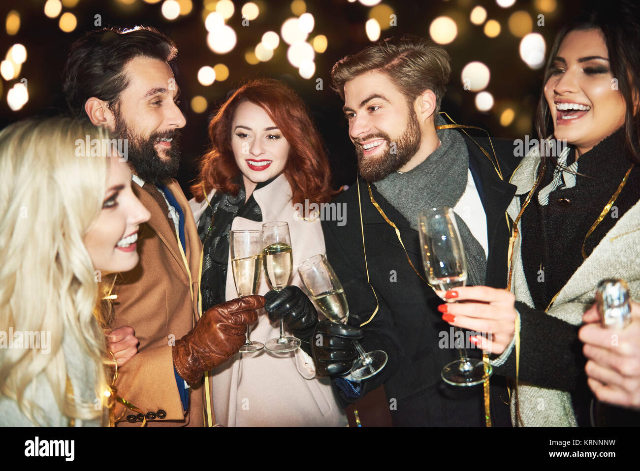 Cheerful friends making a toast Stock Photo - Alamy