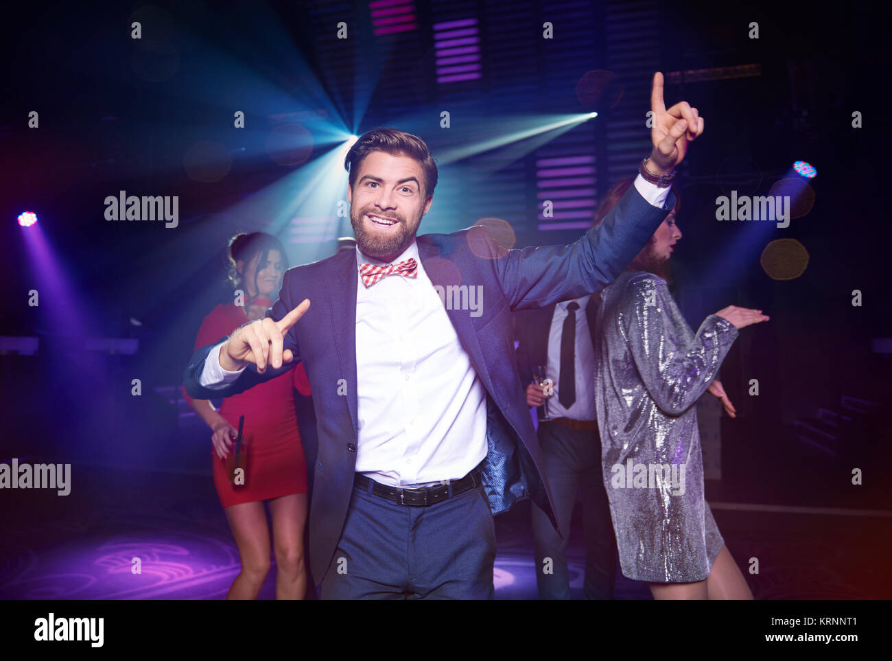 Happy man dancing on disco floor Stock Photo - Alamy