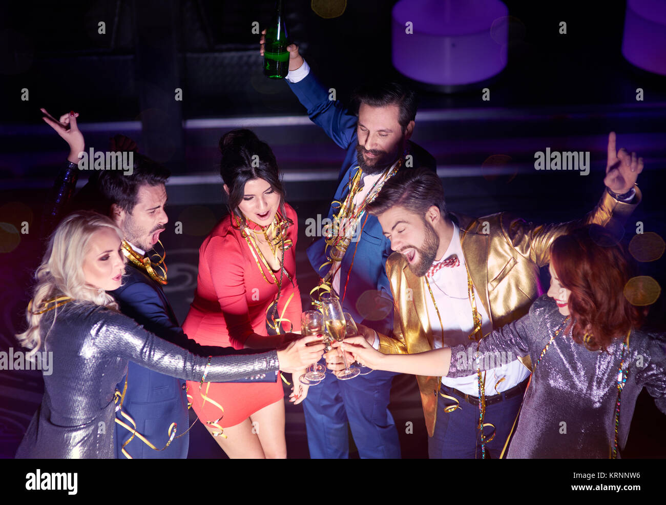 Friends giving a cheer to new year Stock Photo - Alamy