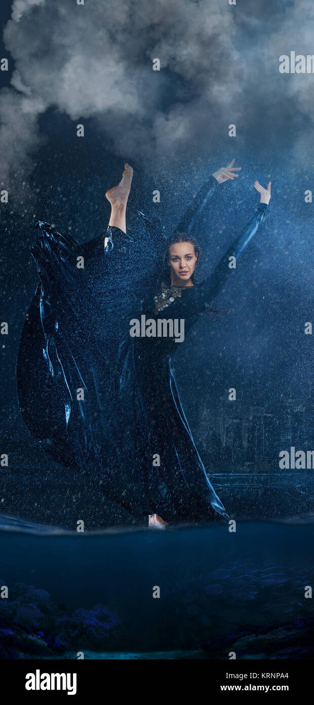 The young beautiful modern dancer dancing under water drops Stock Photo ...