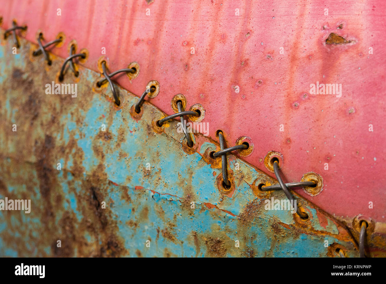 cross-stitch in the sheet metal Stock Photo - Alamy