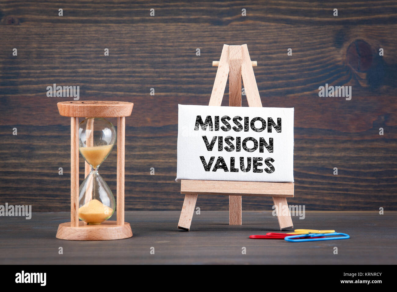 Mission, Vision and Values. Sandglass, hourglass or egg timer on wooden ...