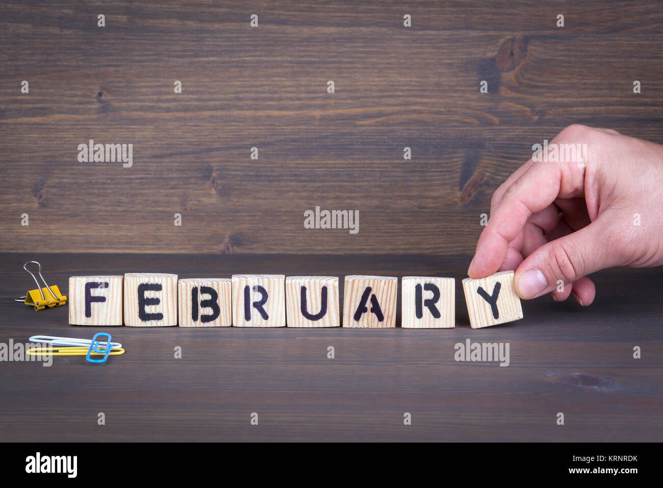 february. Wooden letters on the office desk, informative and ...