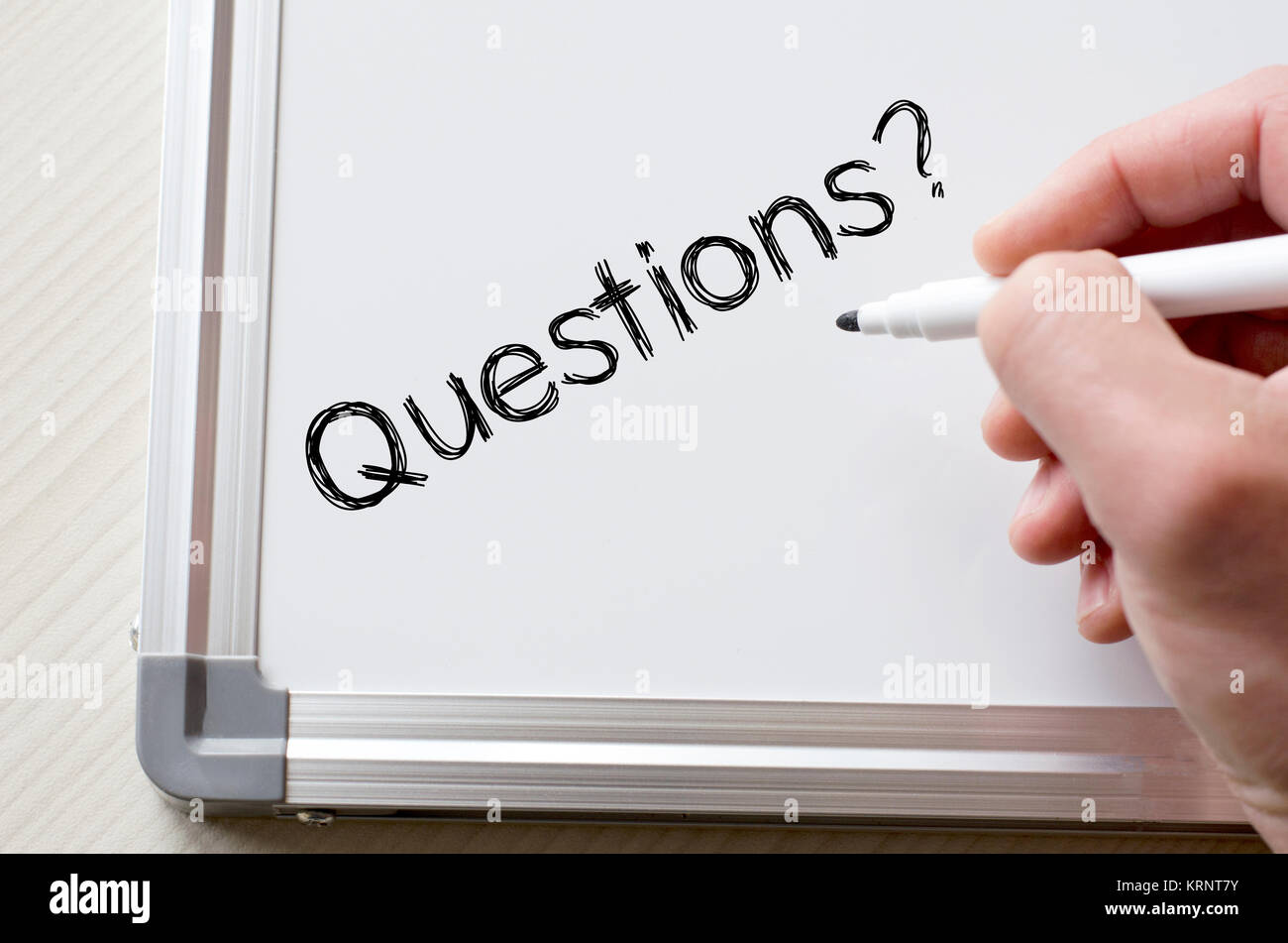 Questions written on whiteboard Stock Photo - Alamy