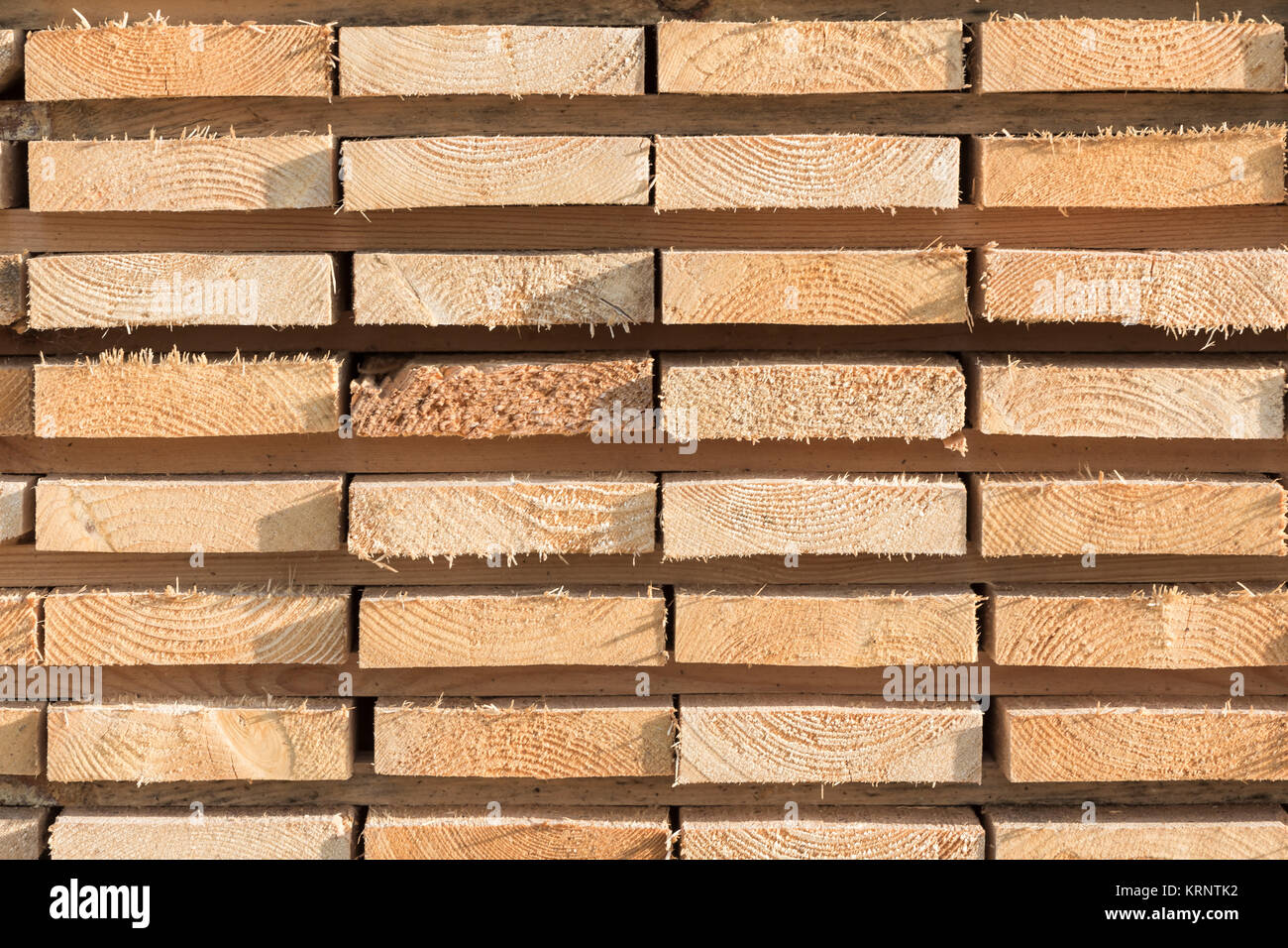 Stacked lumber background Stock Photo - Alamy