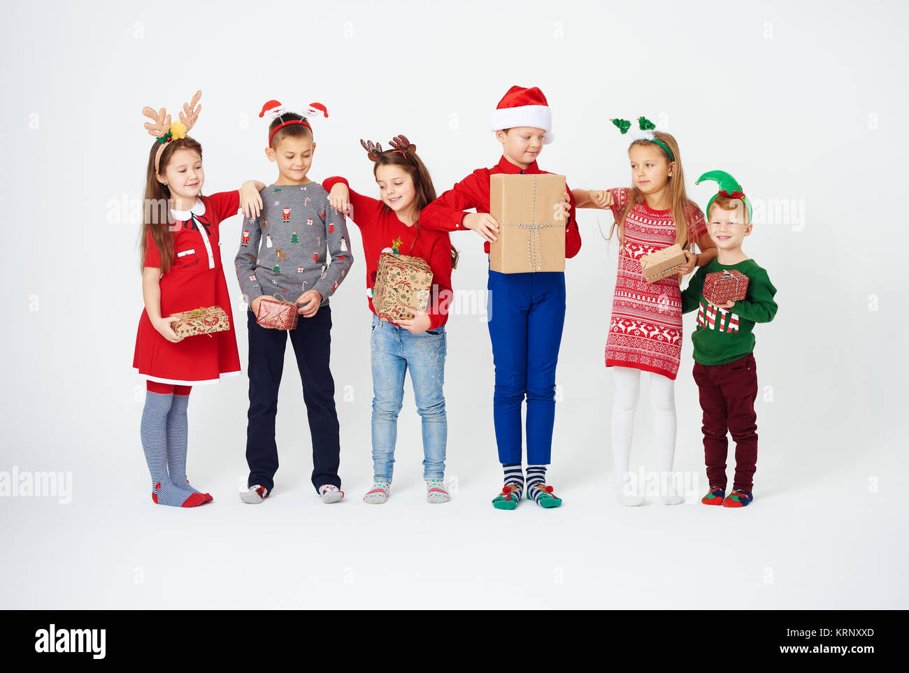 Giving christmas present is our favourite custom Stock Photo - Alamy