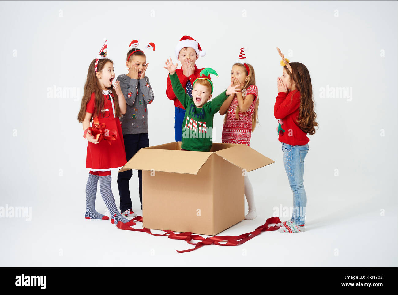 Surprised girl opening present hi-res stock photography and images - Alamy