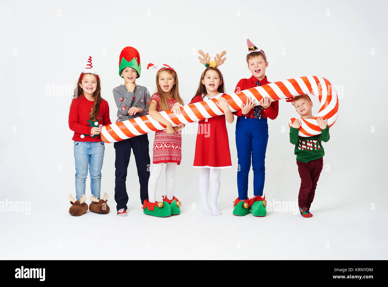 Children with artificial candy cane Stock Photo - Alamy
