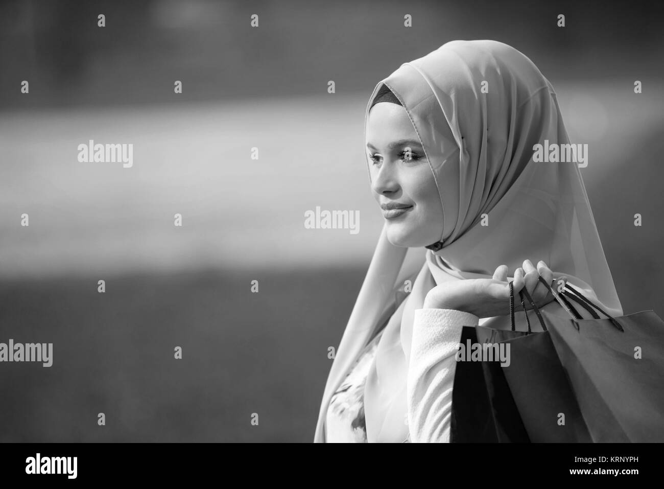Happy muslim girl with shopping bags. conceptual Stock Photo - Alamy
