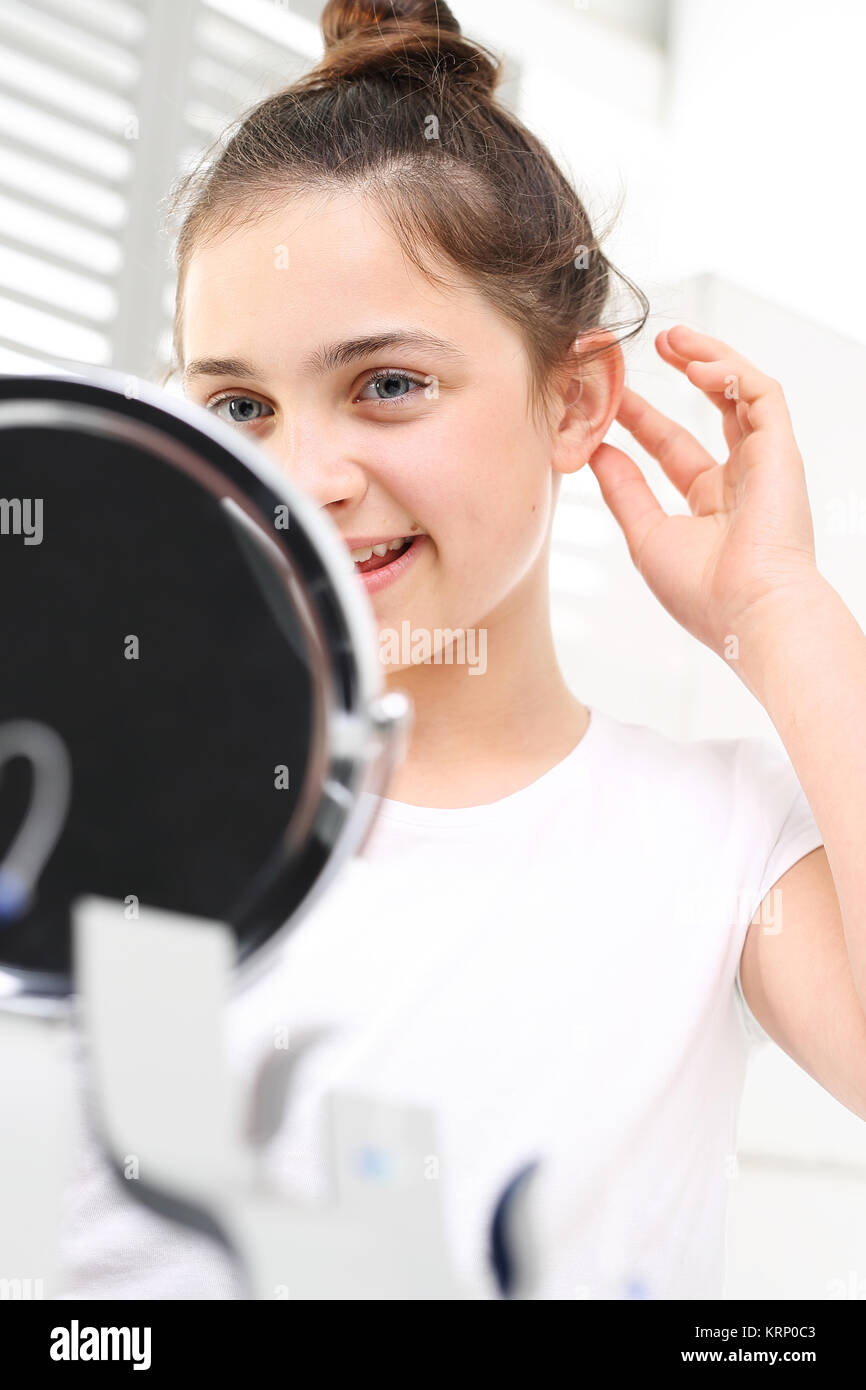 invisible hearing aid. hearing aid for a child Stock Photo - Alamy