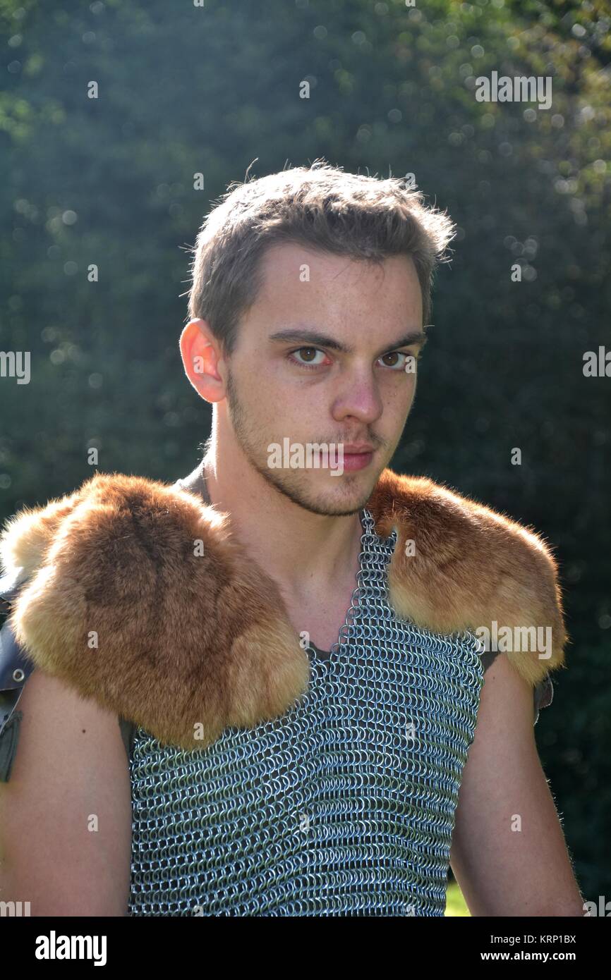medieval man with chain mail and coat on shoulders looks forward Stock ...