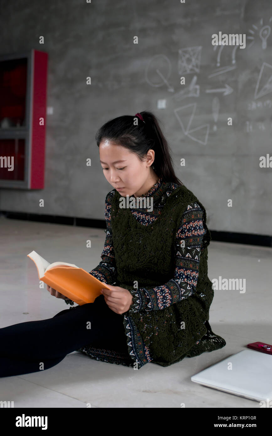Asian student in a classroomb studying. The background of the ...