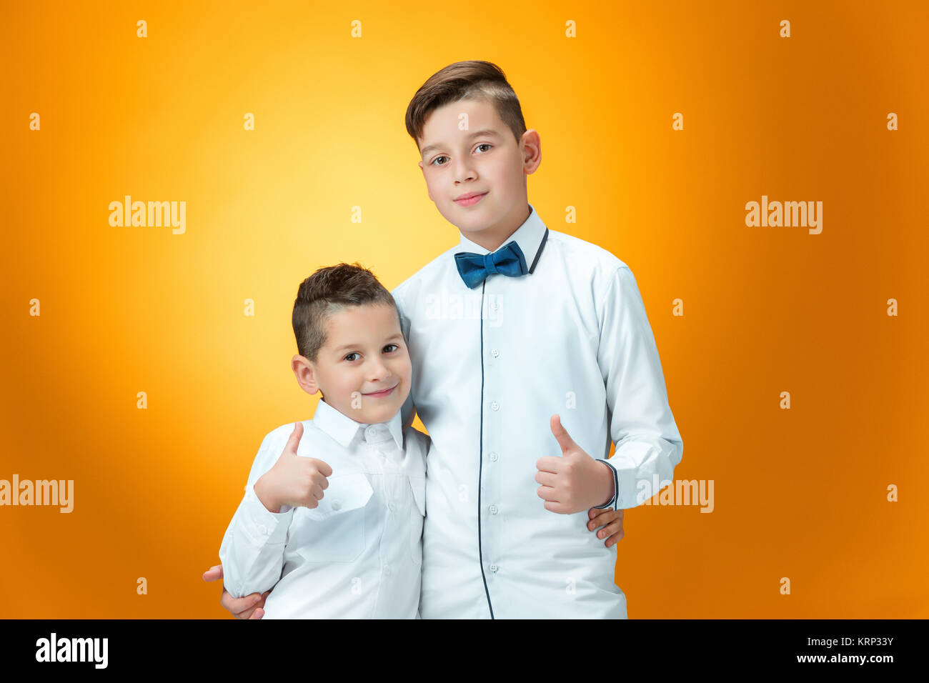 Happy children showing thumbs up sign OK Stock Photo - Alamy
